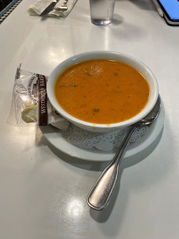 A bowl of tomato soup that proves simple food done right is worth crossing town for, especially paired with that Westminster Bakery packet.