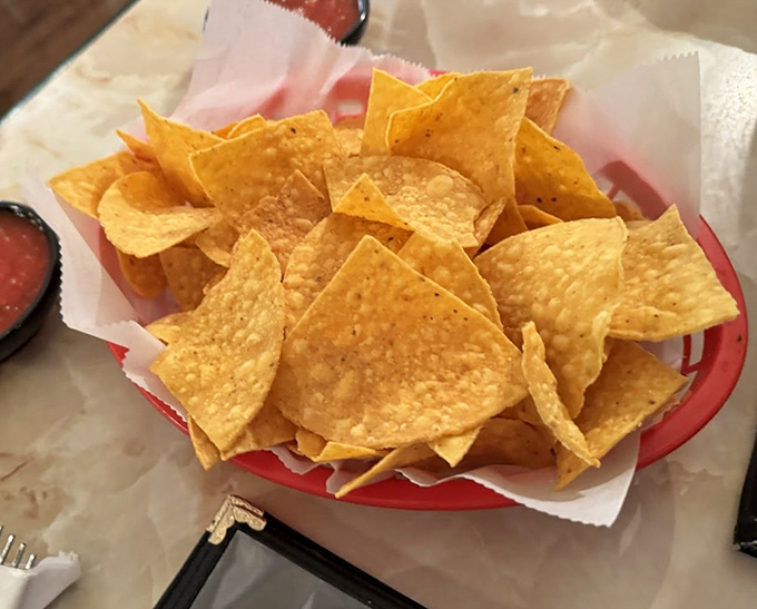House-made tortilla chips that shatter with satisfying crispness. The perfect vehicles for salsa transportation from bowl to mouth.