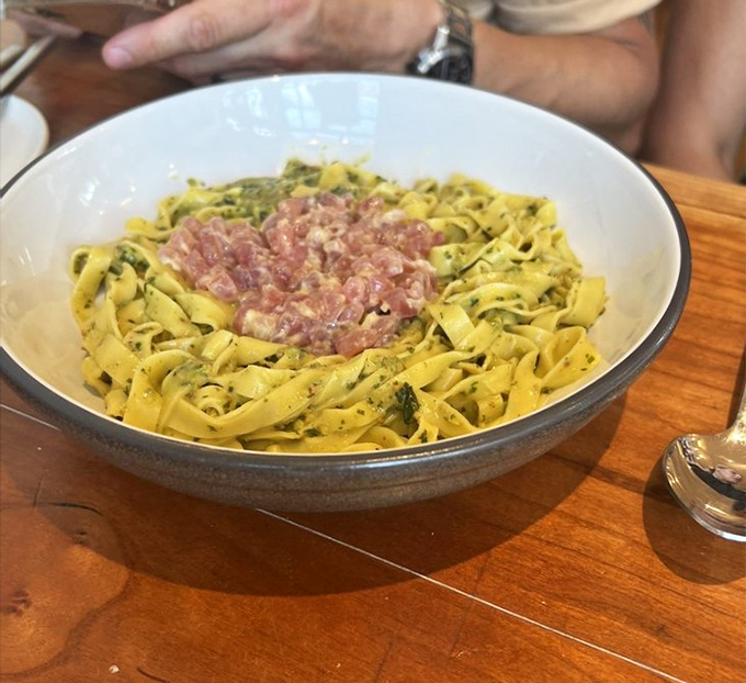 Tagliatelle with what appears to be tuna tartare&mdash;a pasta dish that's both elegant and rustic, like wearing diamonds with your favorite jeans.