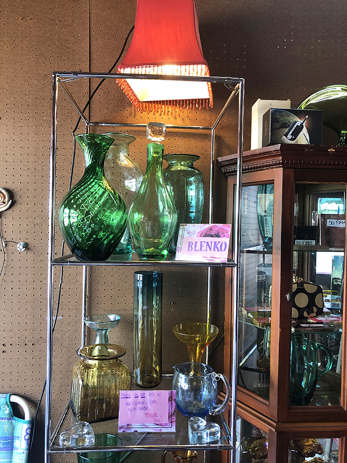Green glass gathering that would make any collector green with envy. These aren't just vases&mdash;they're liquid emeralds for your windowsill.