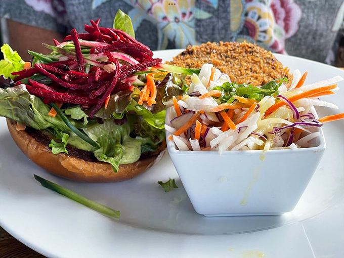 A veggie burger that carnivores secretly order when no one's looking, accompanied by a rainbow slaw that Hawaii does best.