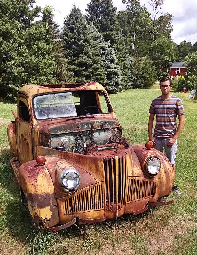 Detroit's rusted glory stands as yard art extraordinaire&mdash;this isn't just a broken-down truck; it's American industrial history on display.