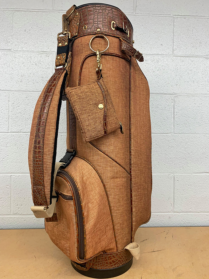 A vintage golf bag with alligator trim that would make Arnold Palmer proud. Someone's country club game is about to get stylishly elevated.
