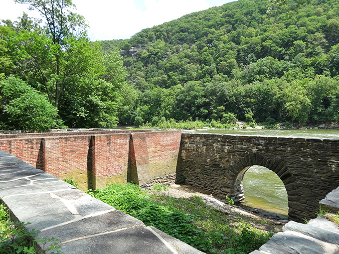 Stone arches frame rushing water, remnants of the industrial past that harnessed river power long before we had apps for everything.