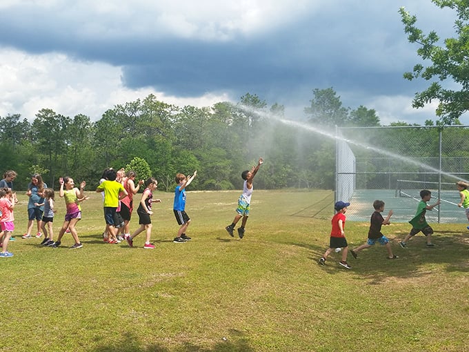 Wee Care Park transforms summer days into childhood memories with sprinklers that rival any fancy water park.