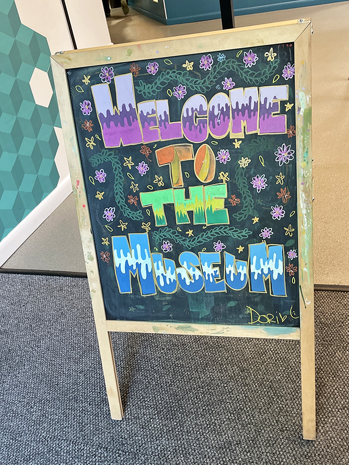 A colorful welcome sign that perfectly captures the museum's playful spirit – where serious fun meets seriously mind-bending science.