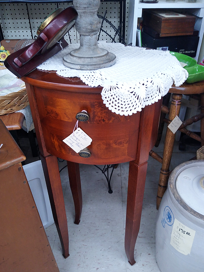 This elegant side table has witnessed decades of coffee cups, whispered conversations, and the gentle placement of reading glasses.