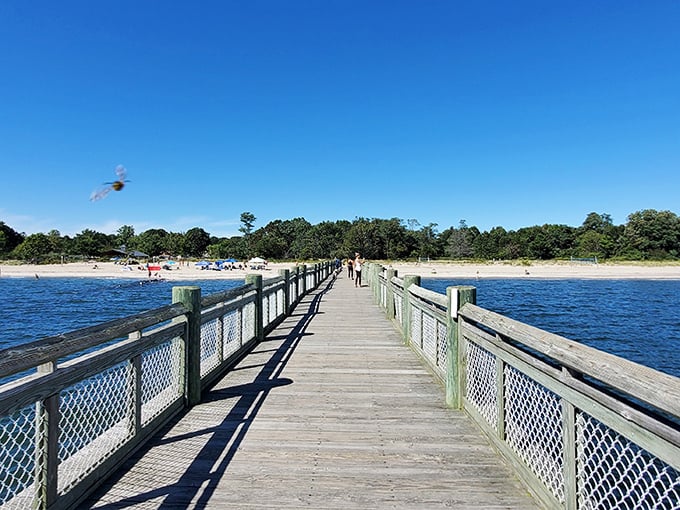 This wooden pier invites you to walk straight into your vacation mindset. The beach awaits at the end of this boardwalk journey.