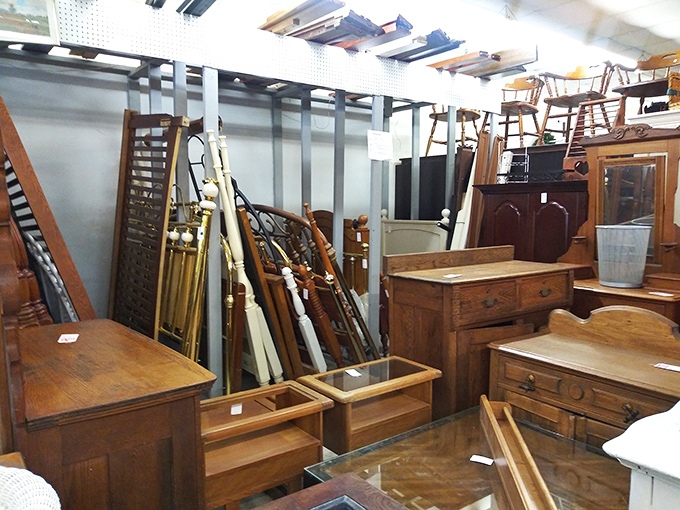 Bedroom furniture purgatory: headboards, footboards, and dressers waiting to be reunited in someone's master bedroom renovation dreams.