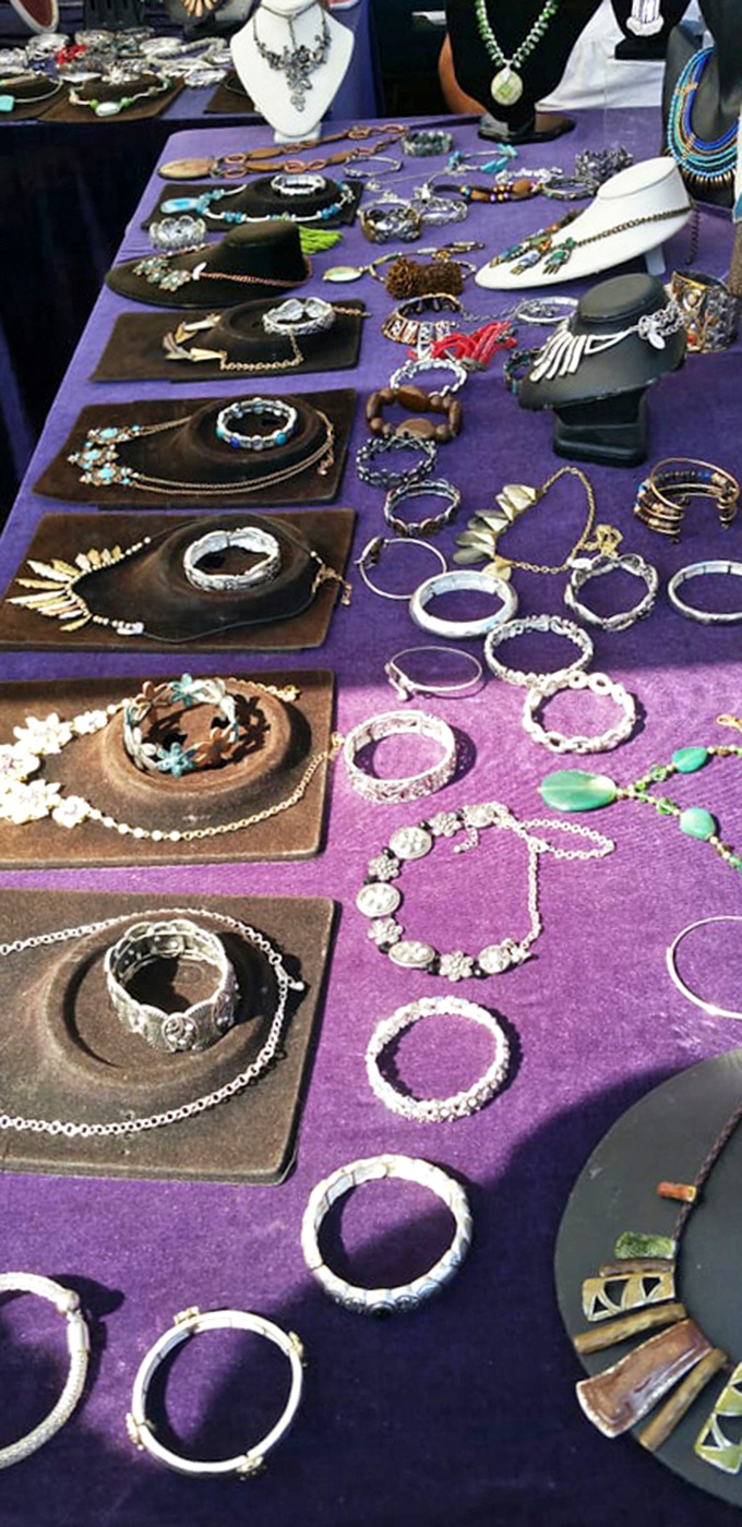 Jewelry that whispers stories! Each handcrafted piece on this purple velvet tableau waits for the right wrist, neck, or finger to continue its journey.