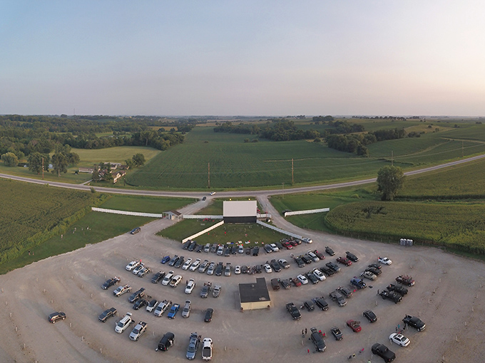 From above, the drive-in reveals its perfect symmetry&mdash;cars arranged in a semicircle facing the screen, a ritual unchanged for generations.