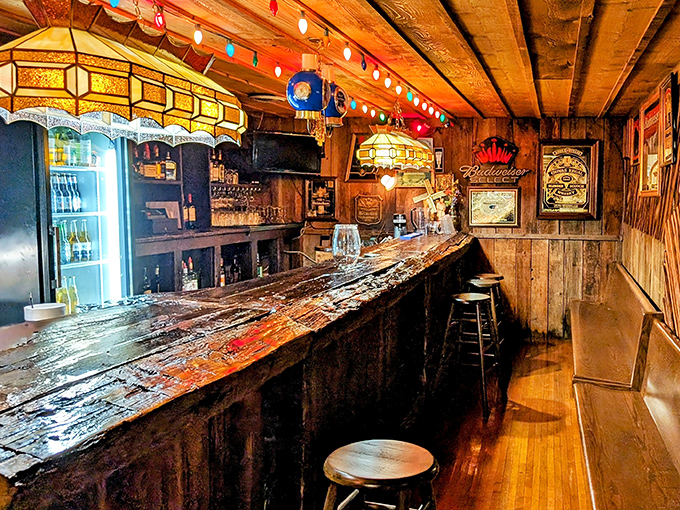 The bar at The Log Inn has witnessed nearly two centuries of celebrations, sorrows, and everything in between. If these boards could talk! 