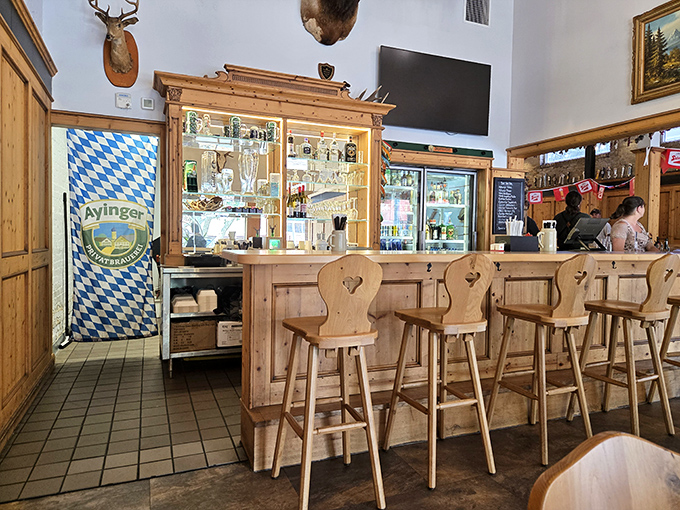 Traditional wooden bar stools invite you to saddle up for an authentic German beer adventure.