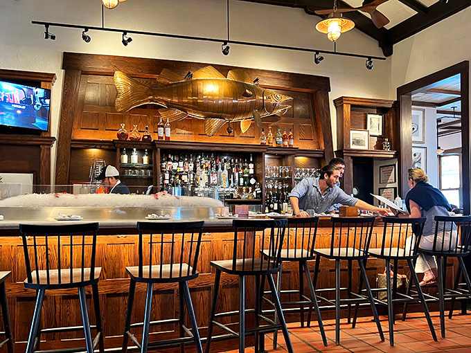 The bar features a impressive carved fish sculpture, because subtle ocean themes are for restaurants that lack confidence and personality.