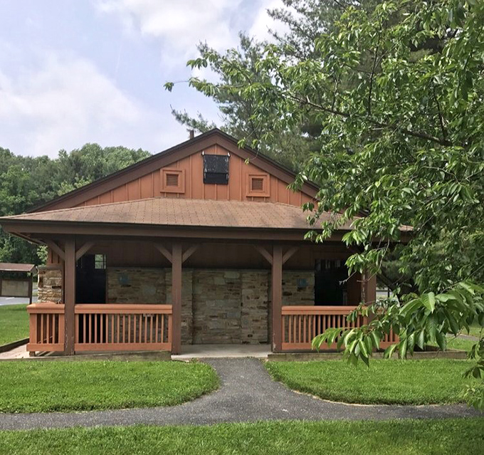 This park restroom&rsquo;s rustic wood and stone design blends naturally into the surrounding greenery, offering a simple, functional stop for visitors enjoying the peaceful Maryland outdoors.