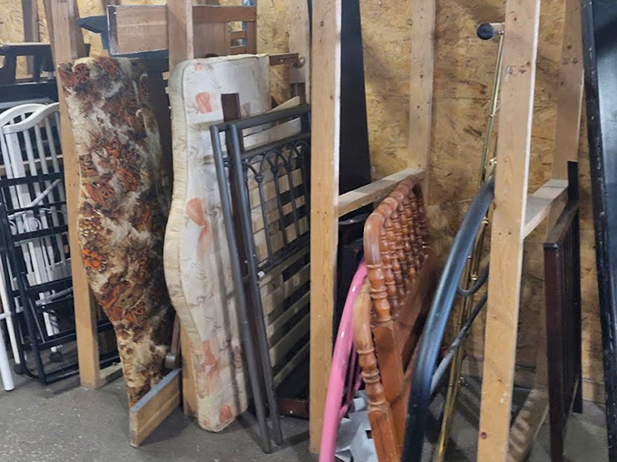 Bedroom furniture stands at attention, waiting for second acts in new homes. These headboards have stories to tell, if walls could talk.