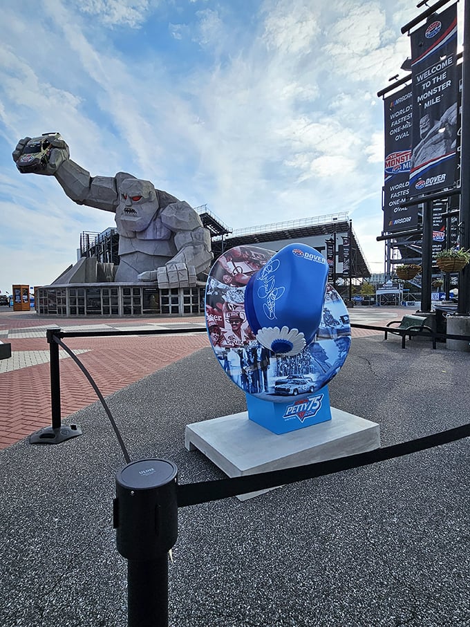 Miles poses with promotional displays, a concrete celebrity always ready for his close-up with adoring NASCAR fans.
