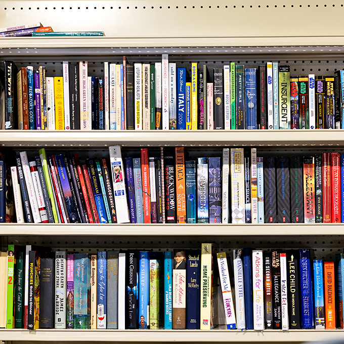 Literary treasures stacked spine-to-spine. Between these shelves lies the possibility of discovering your next favorite author for less than a cup of coffee.