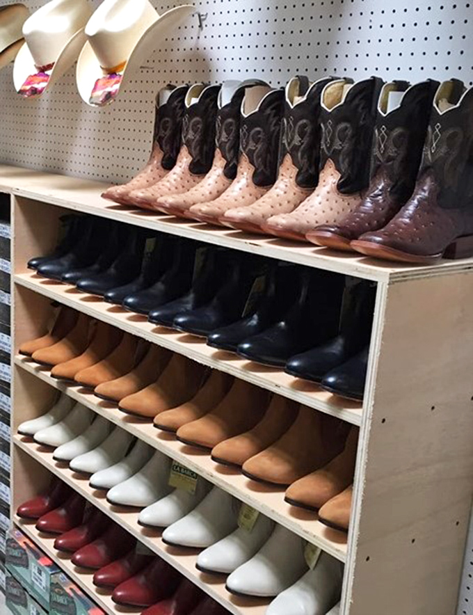 Cowboy boots lined up with military precision &ndash; each pair telling a different story and waiting for its next adventure.