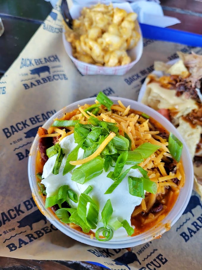 Comfort in a cup: loaded brisket chili topped with green onions and sour cream. It's like a warm hug for your stomach on even the sunniest Florida day.