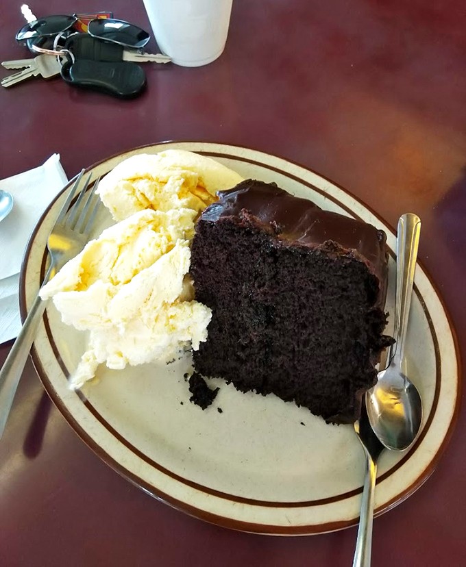 The finale worth saving room for: a slice of chocolate cake with ice cream that proves Powers knows dessert is serious business too.