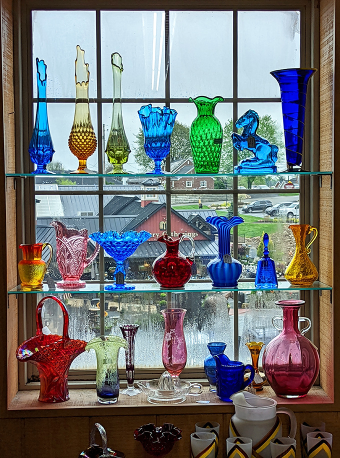 Sunlight transforms these carnival glass pieces into a kaleidoscope of color. Window displays that double as stained glass when the afternoon light hits just right.