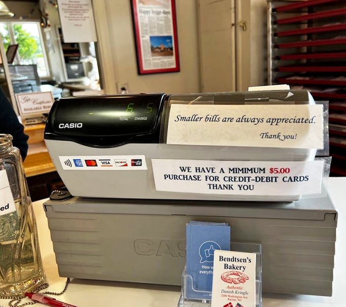 The vintage cash register and handwritten signs remind you that some places remain blissfully immune to the homogenization of modern retail.