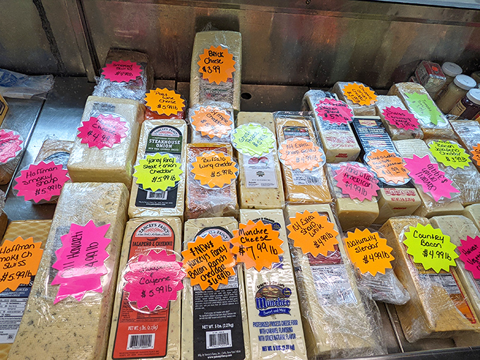 Cheese display so glorious it deserves its own national anthem. Those neon price tags can't begin to describe the flavor journeys waiting inside each block.