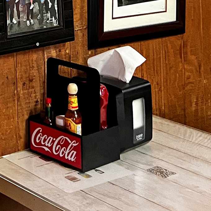 The condiment caddy &ndash; that humble table sentinel ensuring your burger experience can be customized with hot sauce, ketchup, and napkins aplenty.