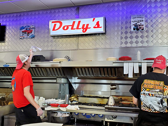 The kitchen symphony at Dolly's&mdash;where short-order cooks perform culinary ballet on a well-seasoned grill that's seen more action than Broadway.