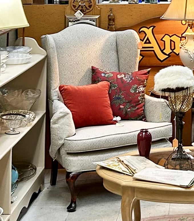 That wingback chair isn't just furniture&mdash;it's a throne for your living room, complete with royal red pillows.