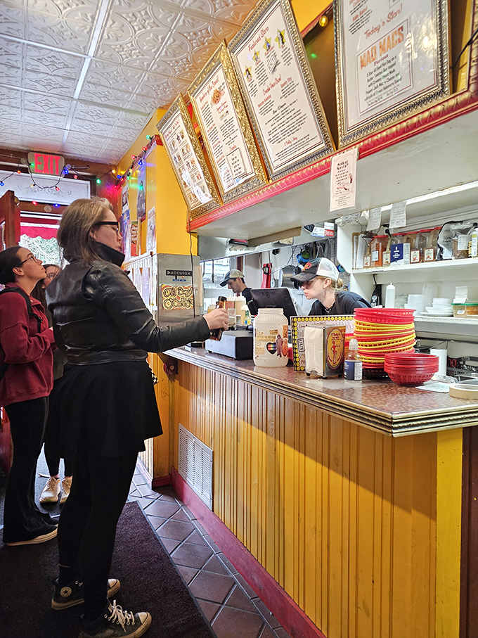 Where the magic happens. The counter at O'Betty's is like the stage door to flavor town, with gold-framed menus setting expectations sky-high.