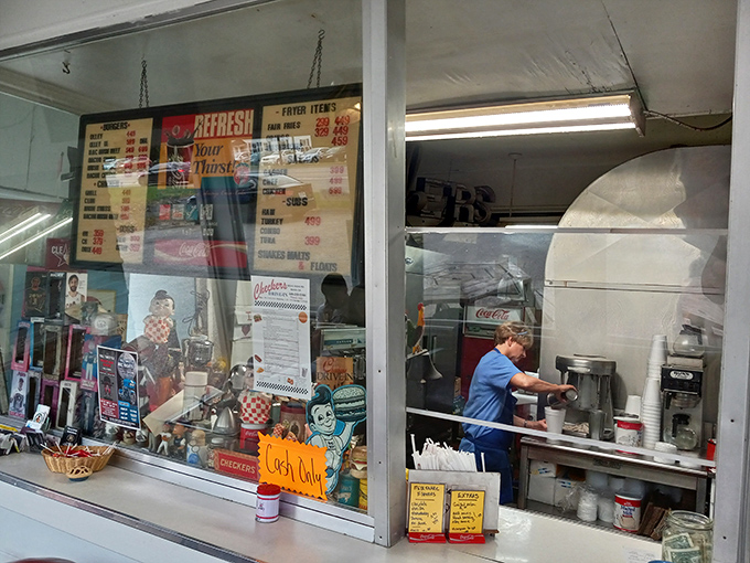 The ordering window&mdash;where dreams are shared and burger magic begins. Simple, efficient, and wonderfully nostalgic.
