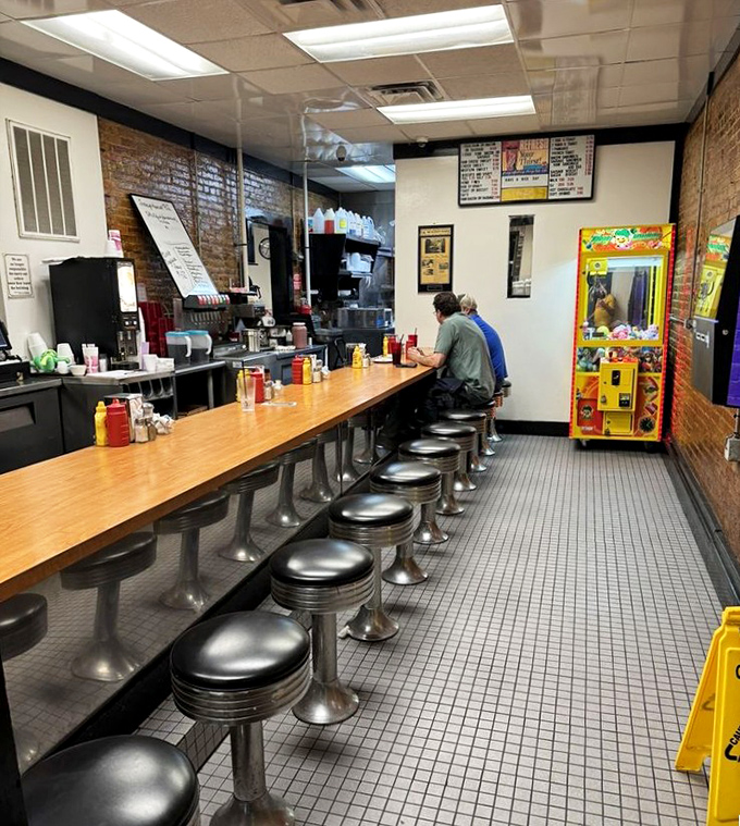 Counter seating: where solo diners become regulars and regulars become family. The best spot to watch burger artistry in action.