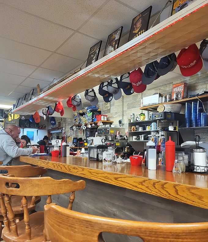 The counter where coffee cup refills appear like magic and breakfast banter flows as freely as the syrup.