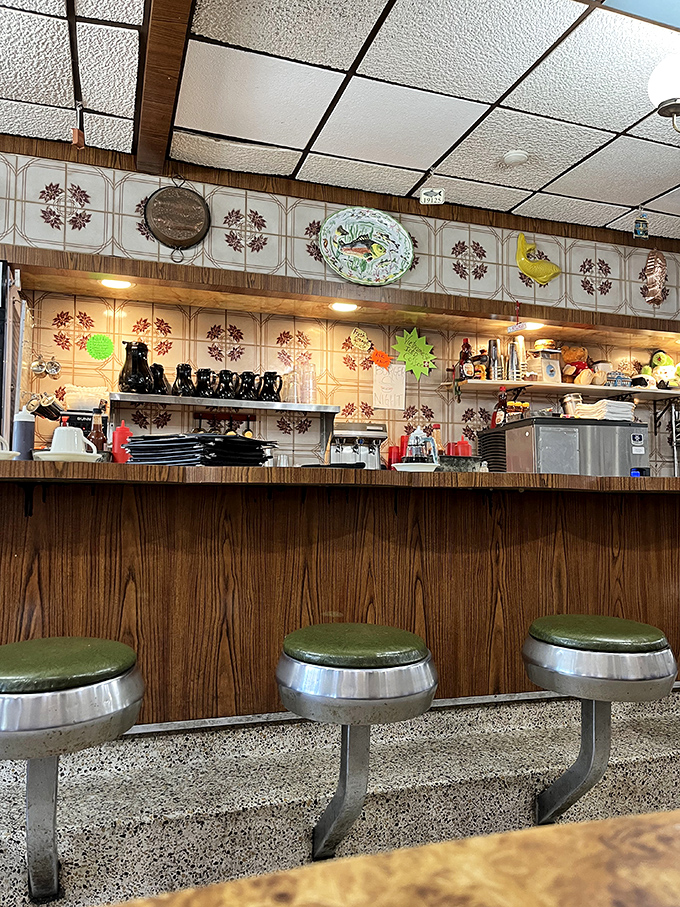 The counter seating – where solo diners become regulars and regulars become family. Green stools that have supported generations of Philadelphians.