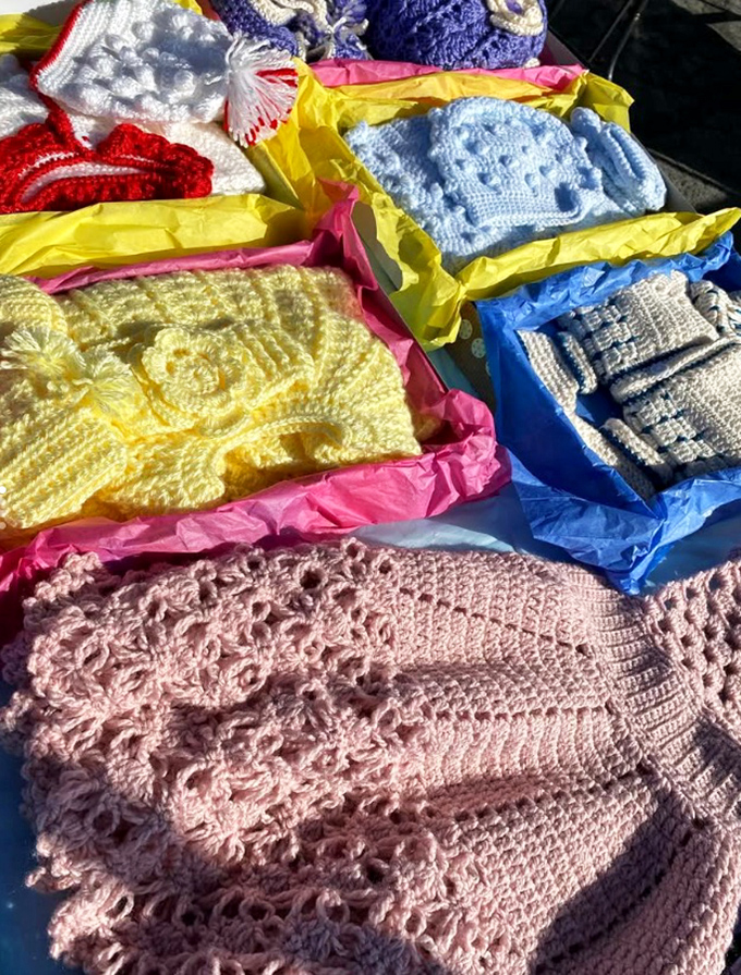 Handcrafted baby blankets tell stories through stitches, each delicate pattern representing hours of someone's loving handiwork.