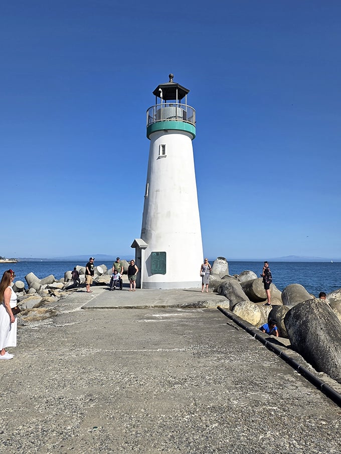 Visitors gather at the base, dwarfed by the 42-foot tower. Everyone looks tiny next to a maritime celebrity.
