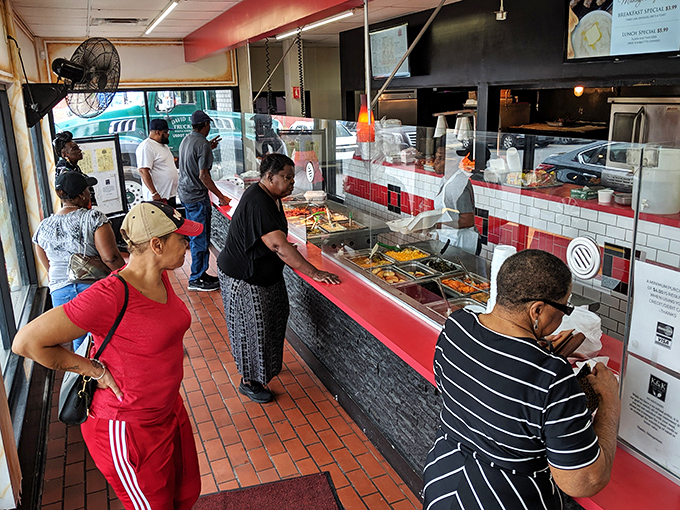 The cafeteria line—where anticipation builds with each step forward. These customers know the reward is worth every minute of waiting.