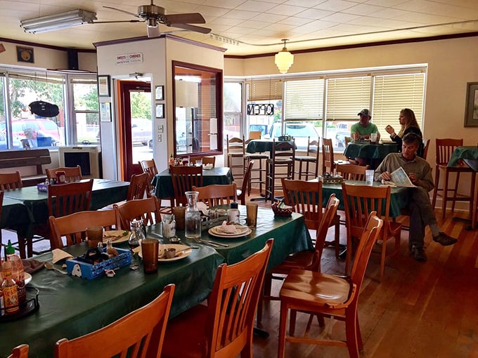 Where locals and travelers break bread together, sharing stories and coffee refills under the gentle whir of ceiling fans.