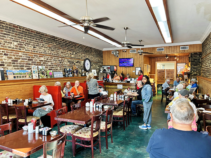 The red booth in the corner isn't just seating—it's Georgetown's unofficial town hall where local wisdom is exchanged over coffee.