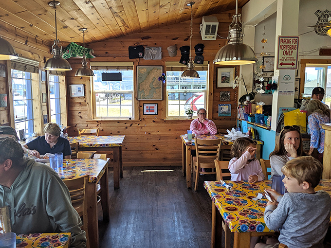 A dining room filled with happy eaters lost in seafood bliss. Notice nobody's looking at their phones&mdash;the food commands complete attention.
