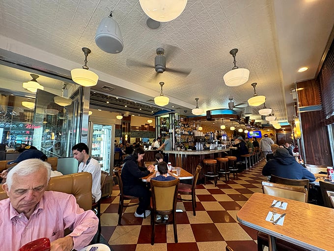 Where strangers become temporary neighbors, united by checkered floors and the universal language of "please pass the ketchup."