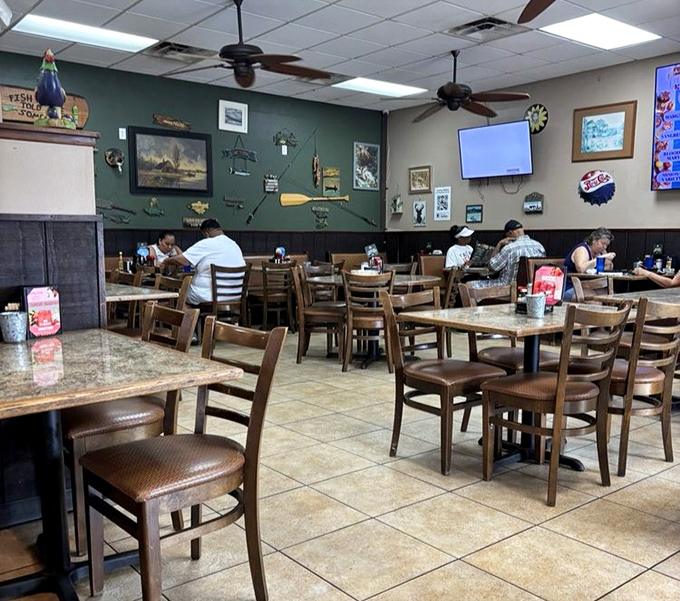 Where fishing memorabilia meets breakfast perfection. This dining room has seen more satisfied customers than Disney has seen mouse ears.