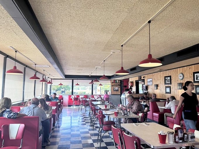 A bustling dining room where strangers become neighbors over coffee, united by the universal language of "pass the syrup, please."