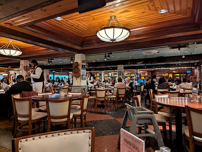 A bustling dining room where the ceiling's wooden beams have witnessed countless "Oh my God" moments as plates arrive at eager tables.