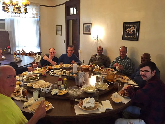 A table of satisfied diners proves that good food brings people together. The lazy Susan has worked its magic, creating a shared experience around the table.