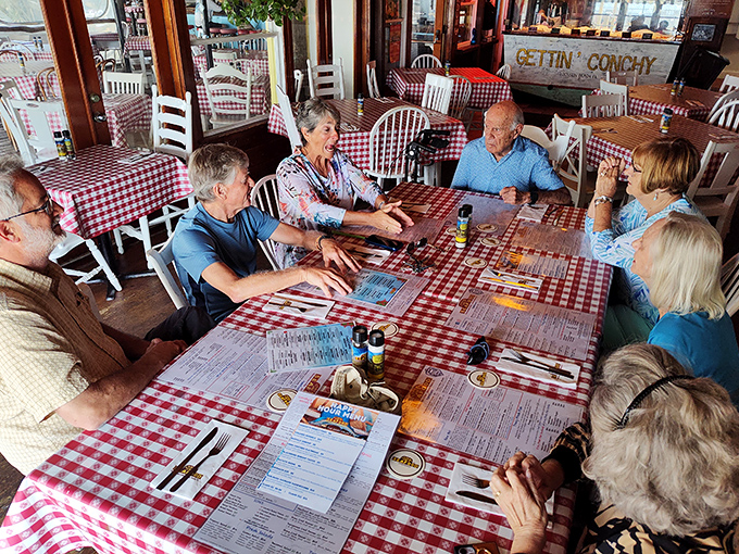Where strangers become friends over seafood and stories. The red-checkered tablecloths aren't just decor &ndash; they're part of the experience.