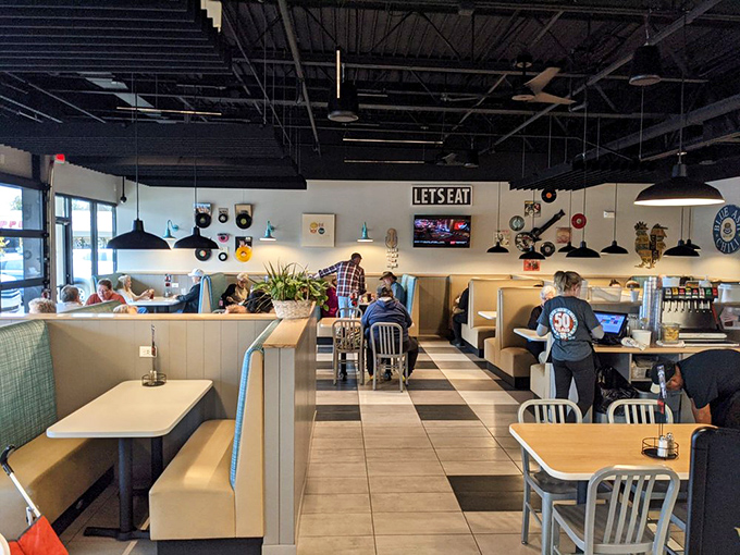 The dining room buzzes with the sound of happy eaters. That "LET'S EAT" sign isn't making suggestions&mdash;it's documenting what's already happening.