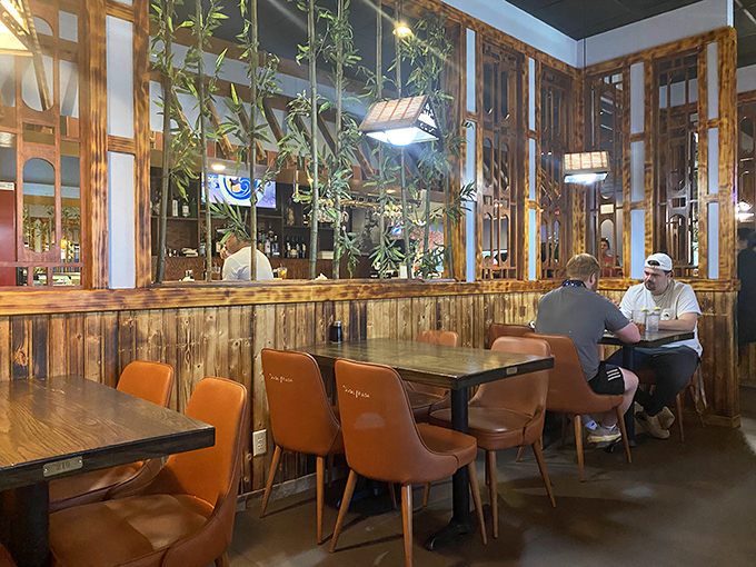 Wooden dividers create intimate dining spaces where you can focus on what's important: deciding how many more rolls you can reasonably order.